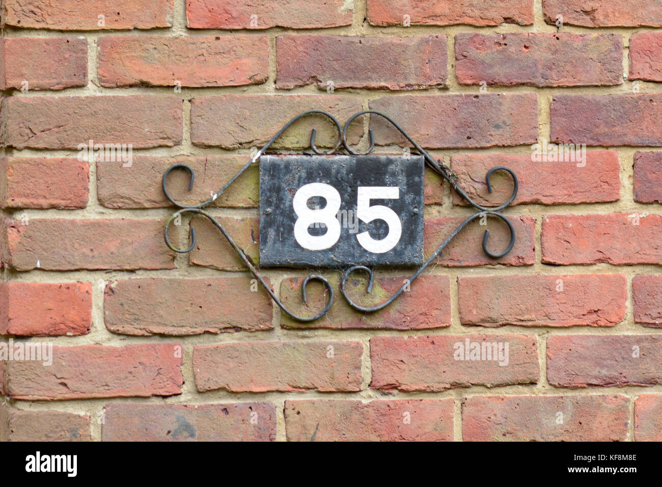 House number 85 sign on wall Stock Photo - Alamy