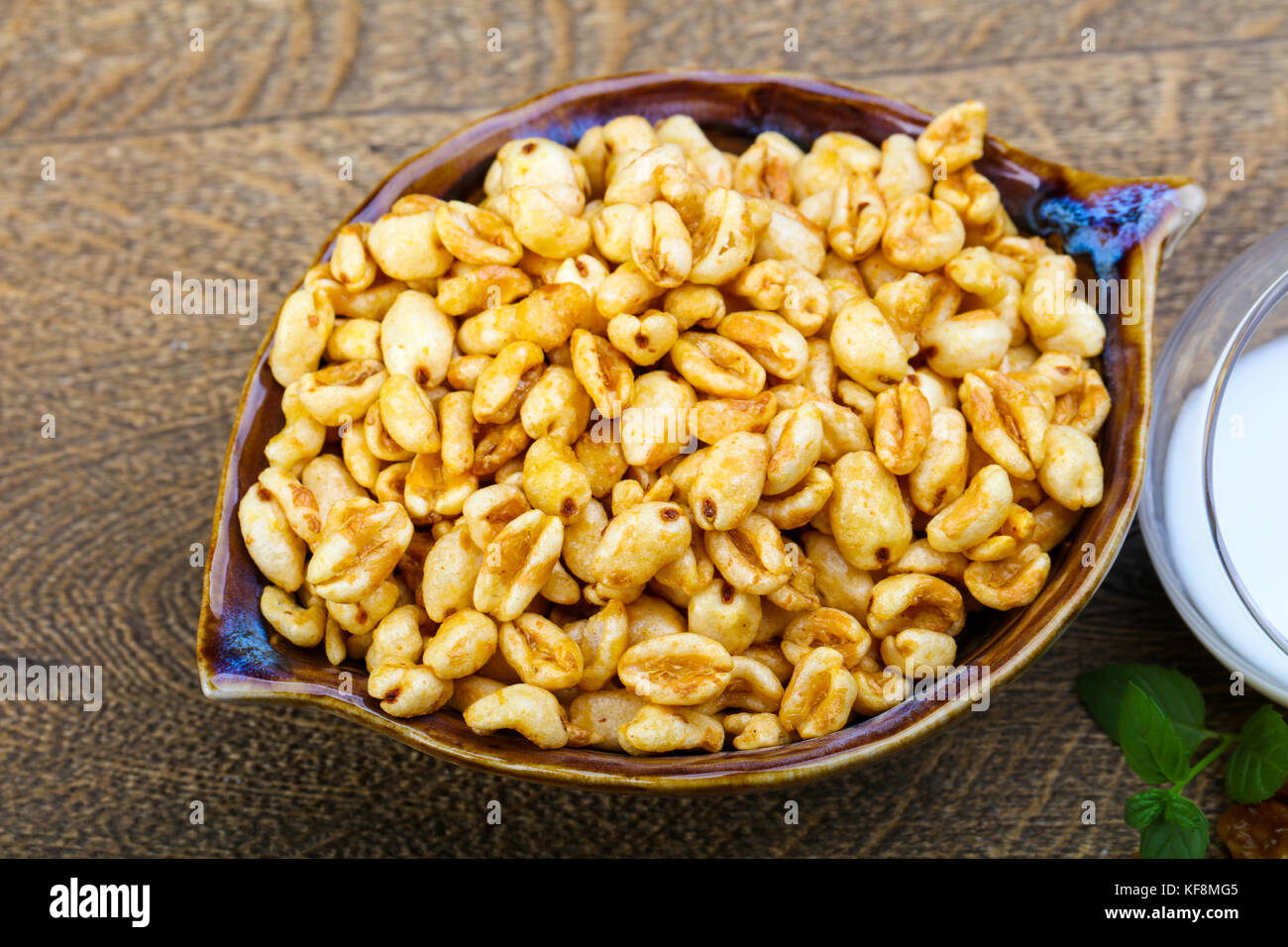 Rise flakes with milk, raisin and mint leaves Stock Photo - Alamy