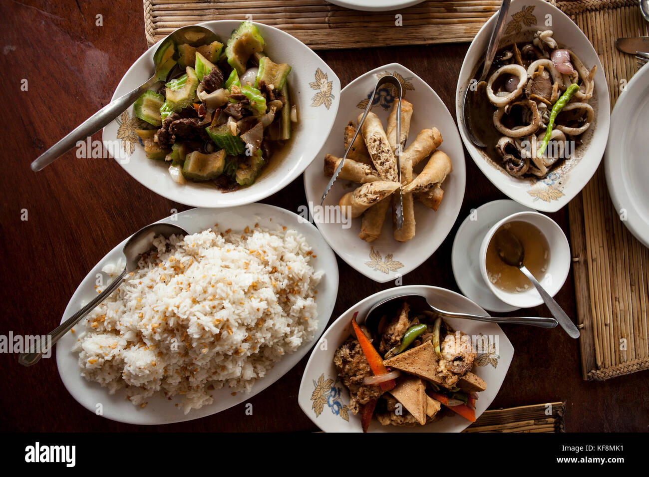PHILIPPINES, Palawan, Puerto Princesa, table loaded with amazing dishes ...