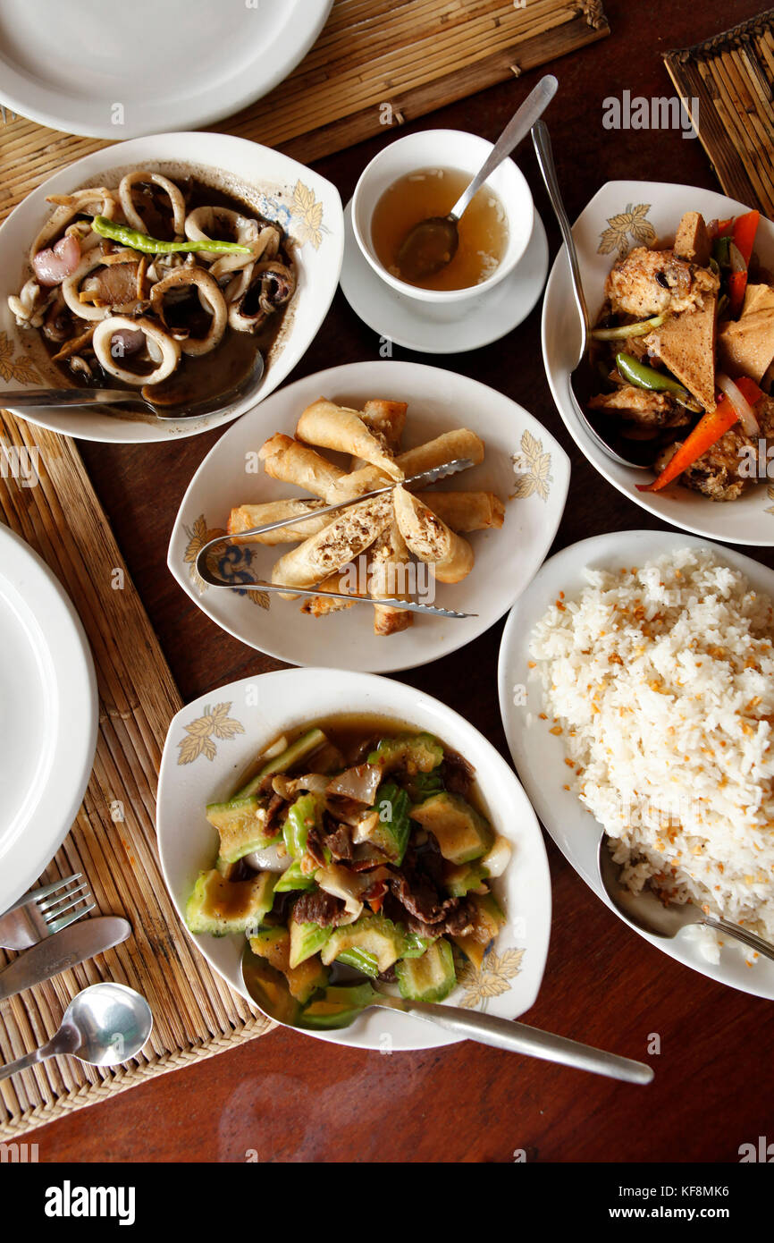 PHILIPPINES, Palawan, Puerto Princesa, table loaded with amazing dishes ...