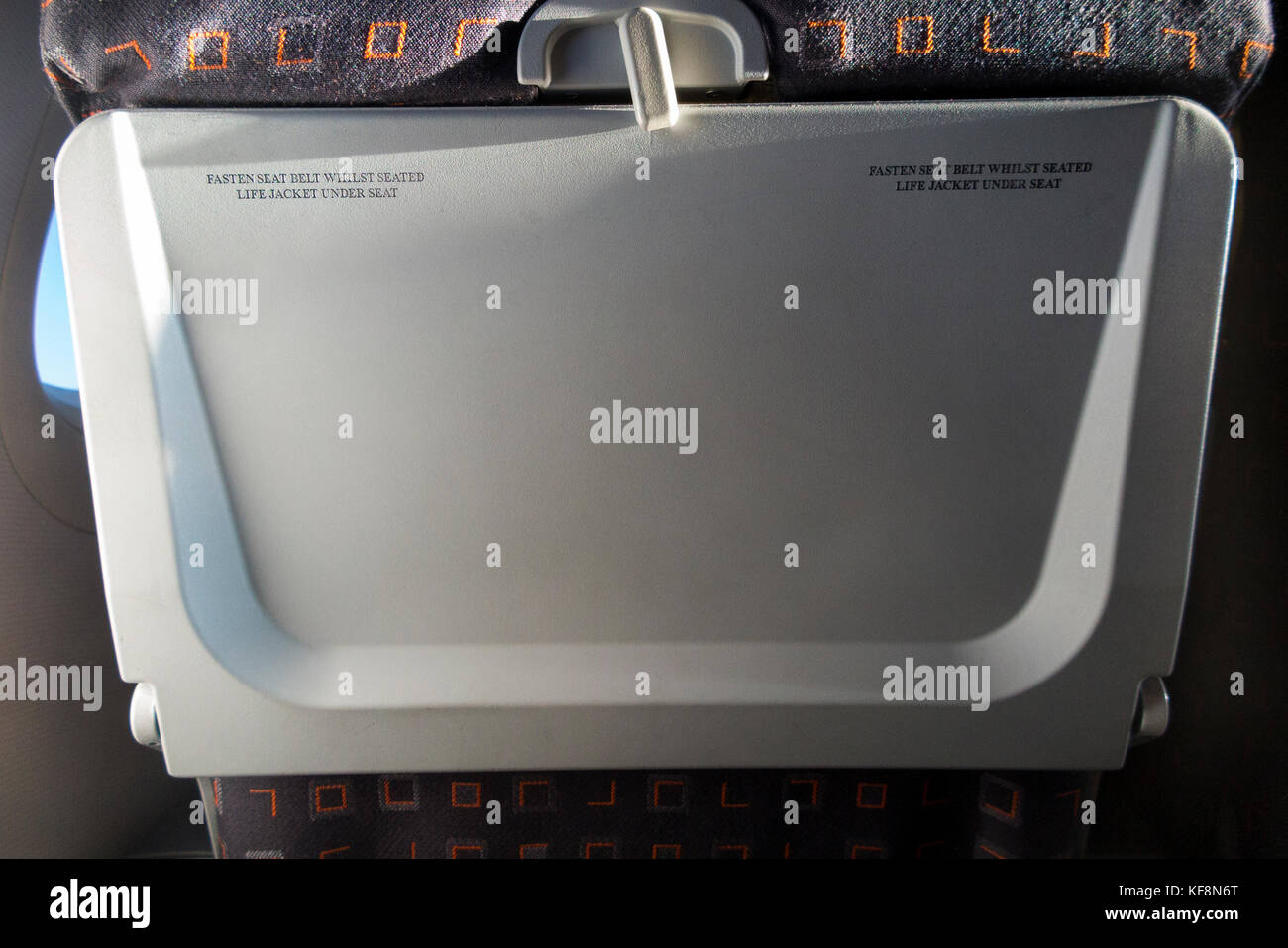 Passenger seat tray table in the full upright position on an Airbus ...