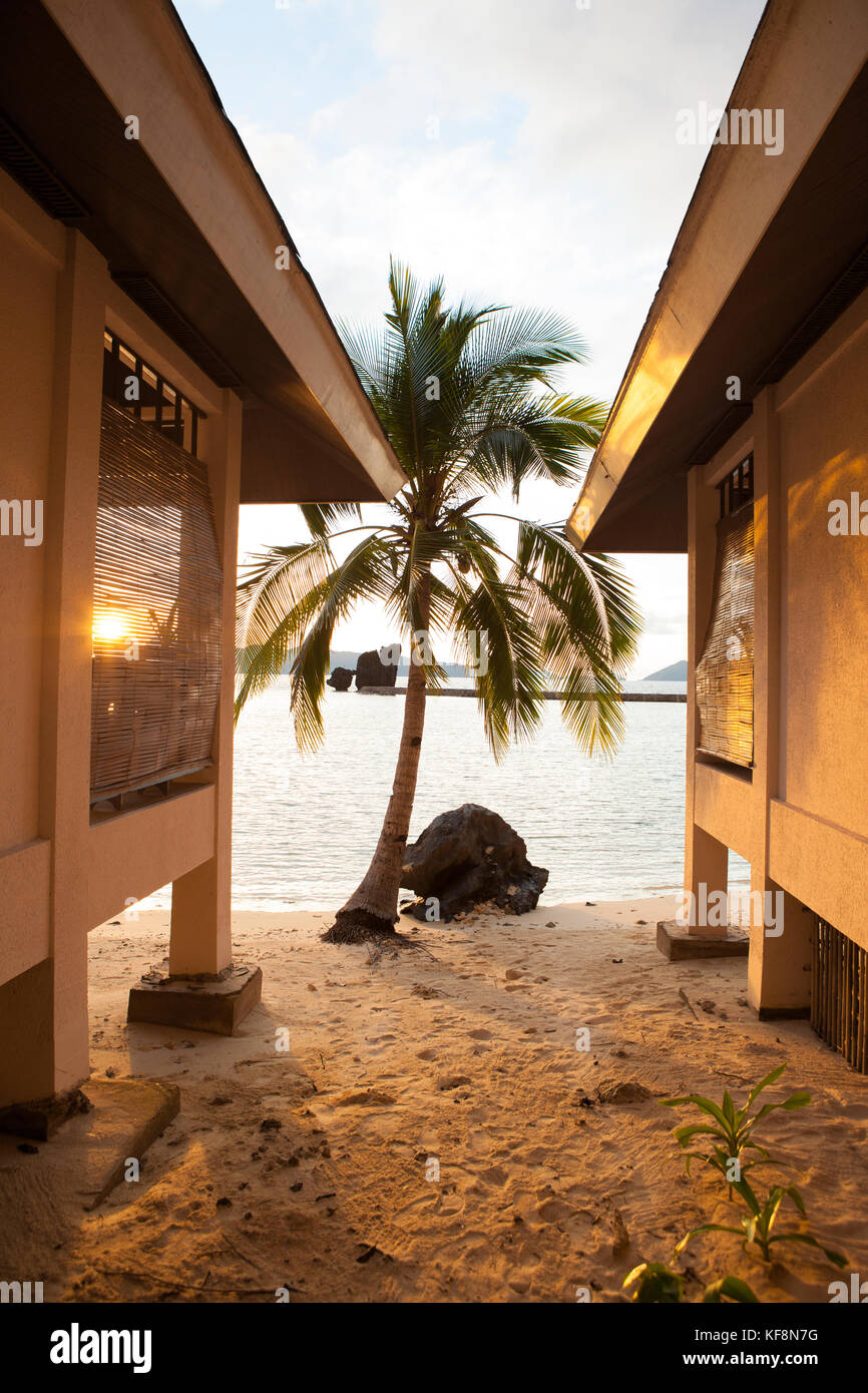PHILIPPINES, Palawan, El Nido, Lagen Island Resort cottages sit over ...