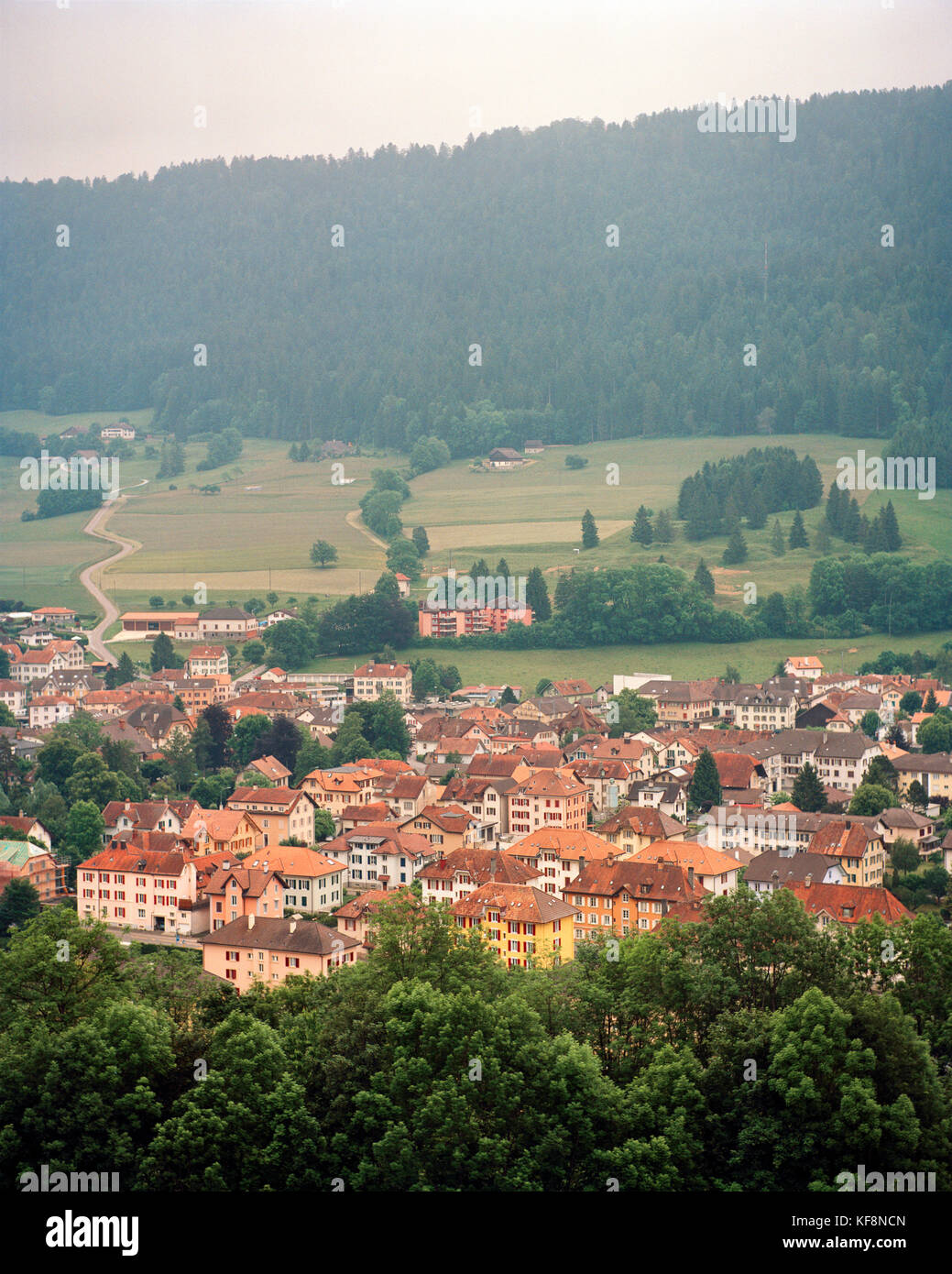 SWITZERLAND, Couvet, elevated hillside view of the town of Couvet, Jura ...