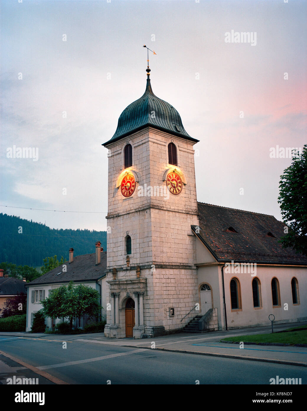 SWITZERLAND, Couvet, a building and street in town in the early morning ...