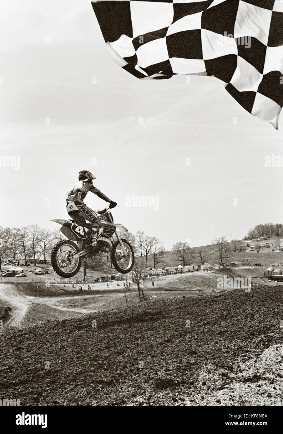 USA, Tennessee, motocross winner jumping across the finish line (B&W ...