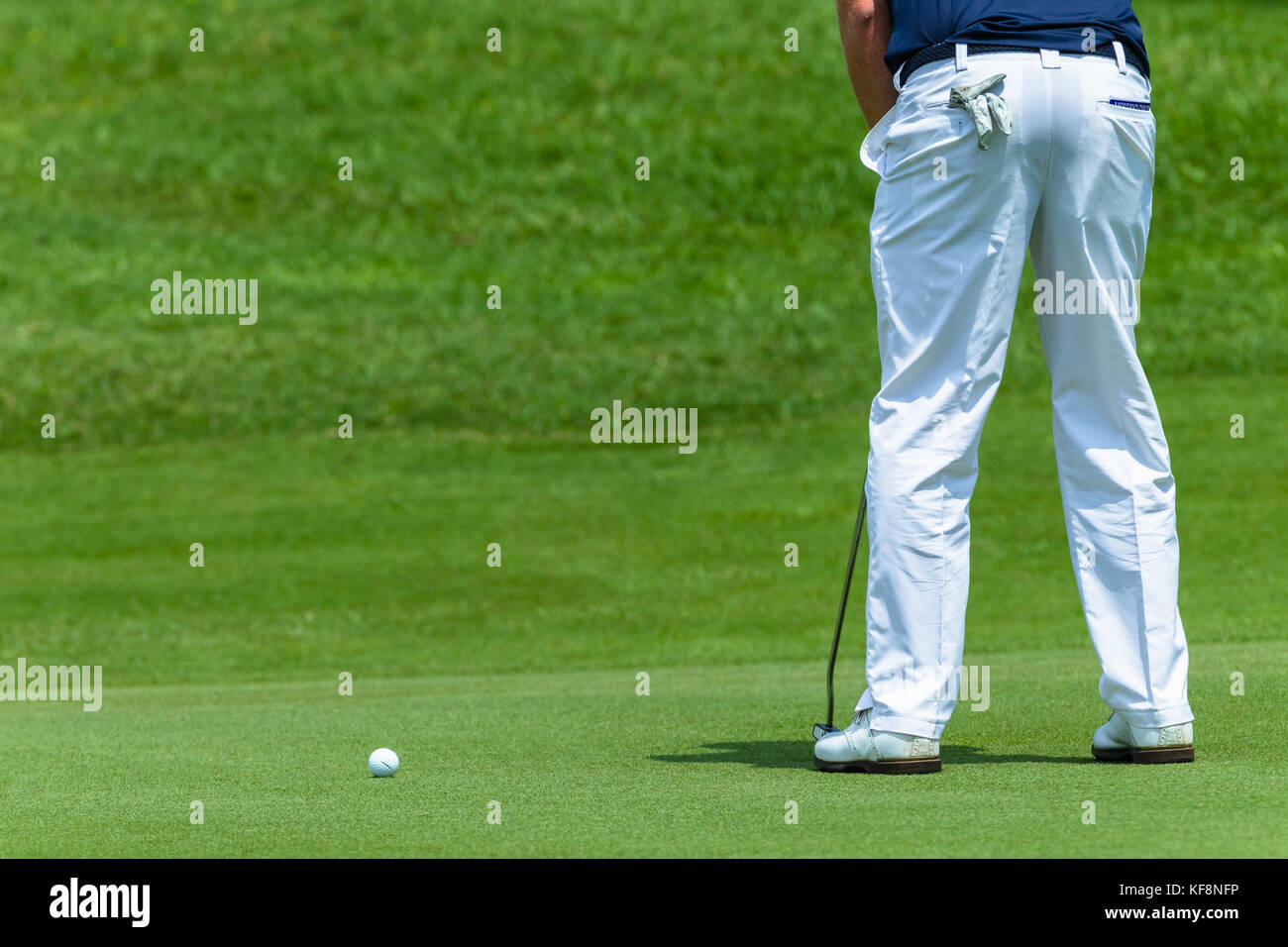 Golf player putting ball green closeup abstract rear photo Stock Photo ...