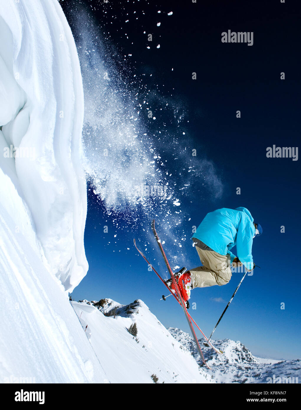 USA, Utah, man skiing off cornice, Early Yellow Trail, Alta Ski Resort ...