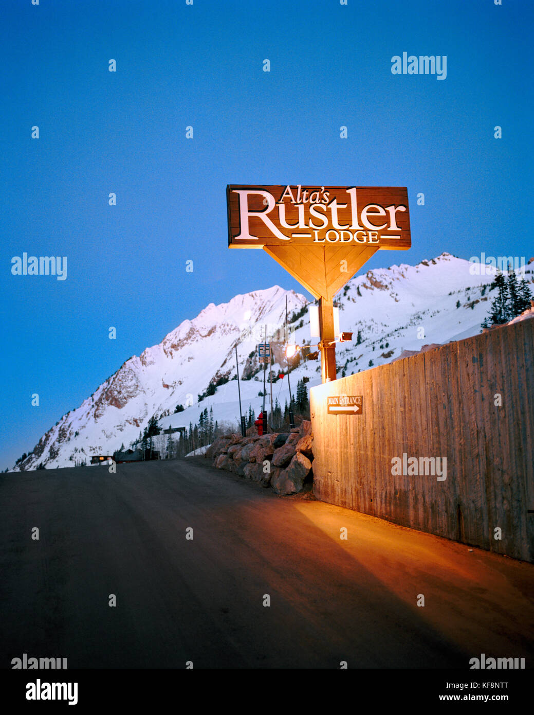 USA, Utah, Rustler Lodge sign and Mount Superior at dusk, Alta Ski ...