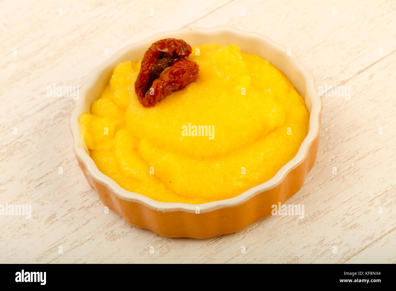 Polenta with dry tomato Stock Photo - Alamy