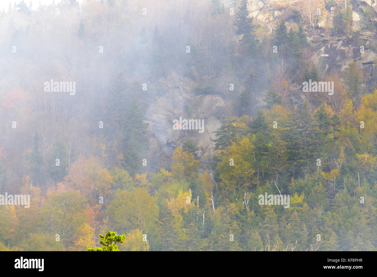 Smoke from a forest fire on Dilly Cliff in Kinsman Notch, New Hampshire ...