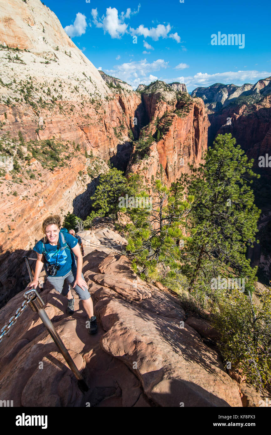 Hiker walking over the narrow edge of Angel´s landing, Zion National ...