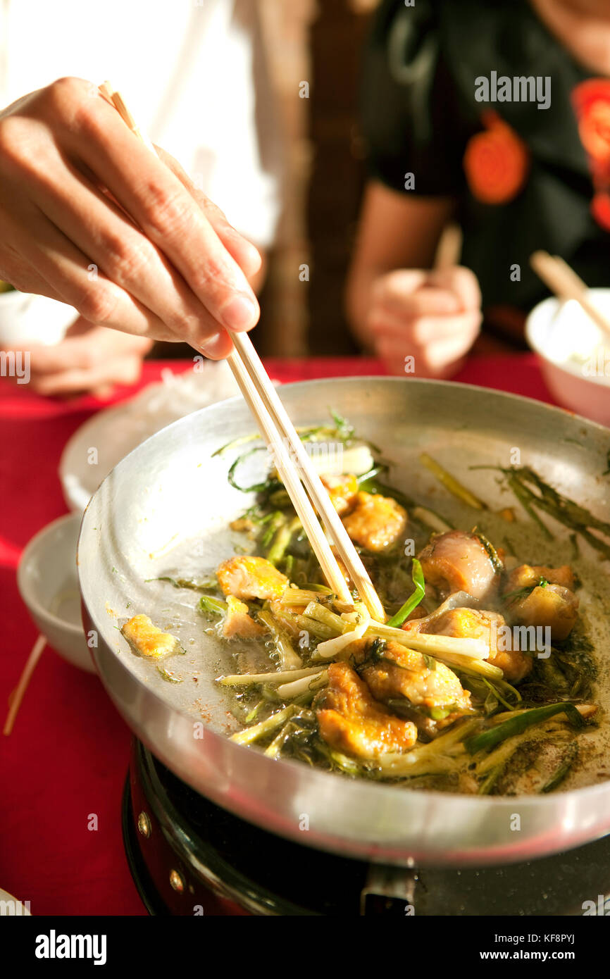 VIETNAM, Hanoi, Thuy, famous snakehead fish dish being cooked in ...