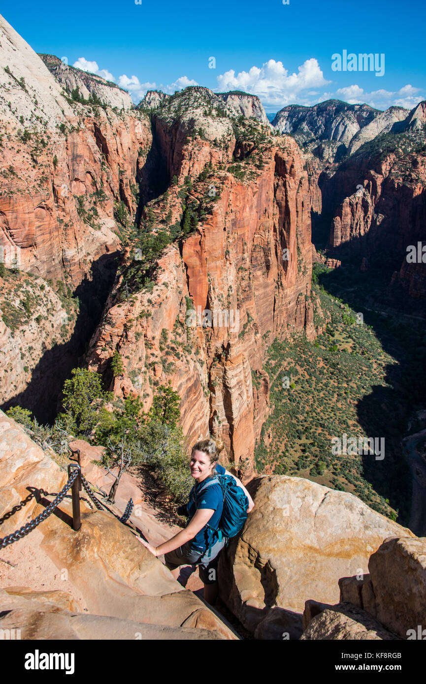 Hiker walking over the narrow edge of Angel´s landing, Zion National ...