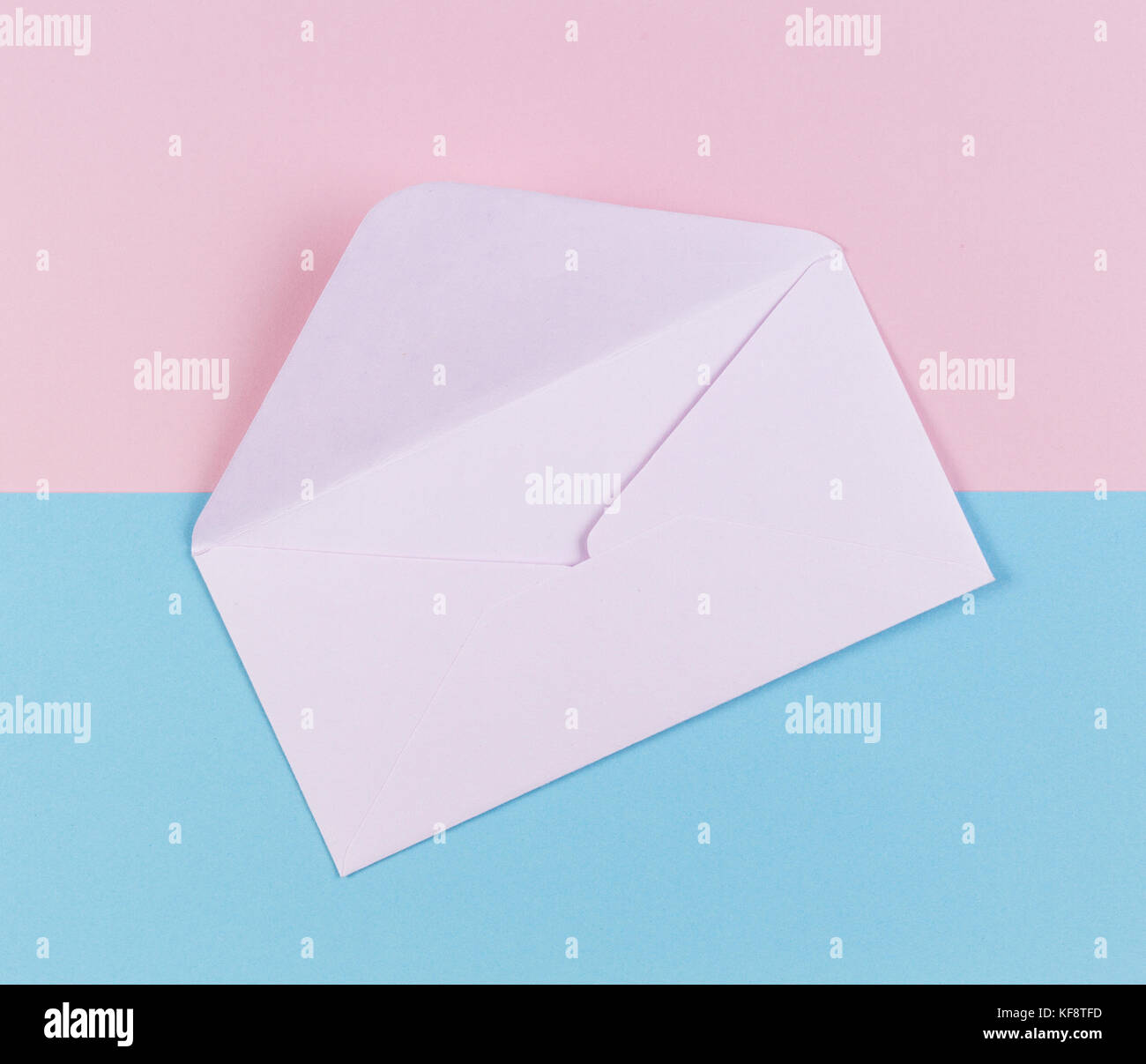 Open envelope on colored pink and blue background Stock Photo - Alamy
