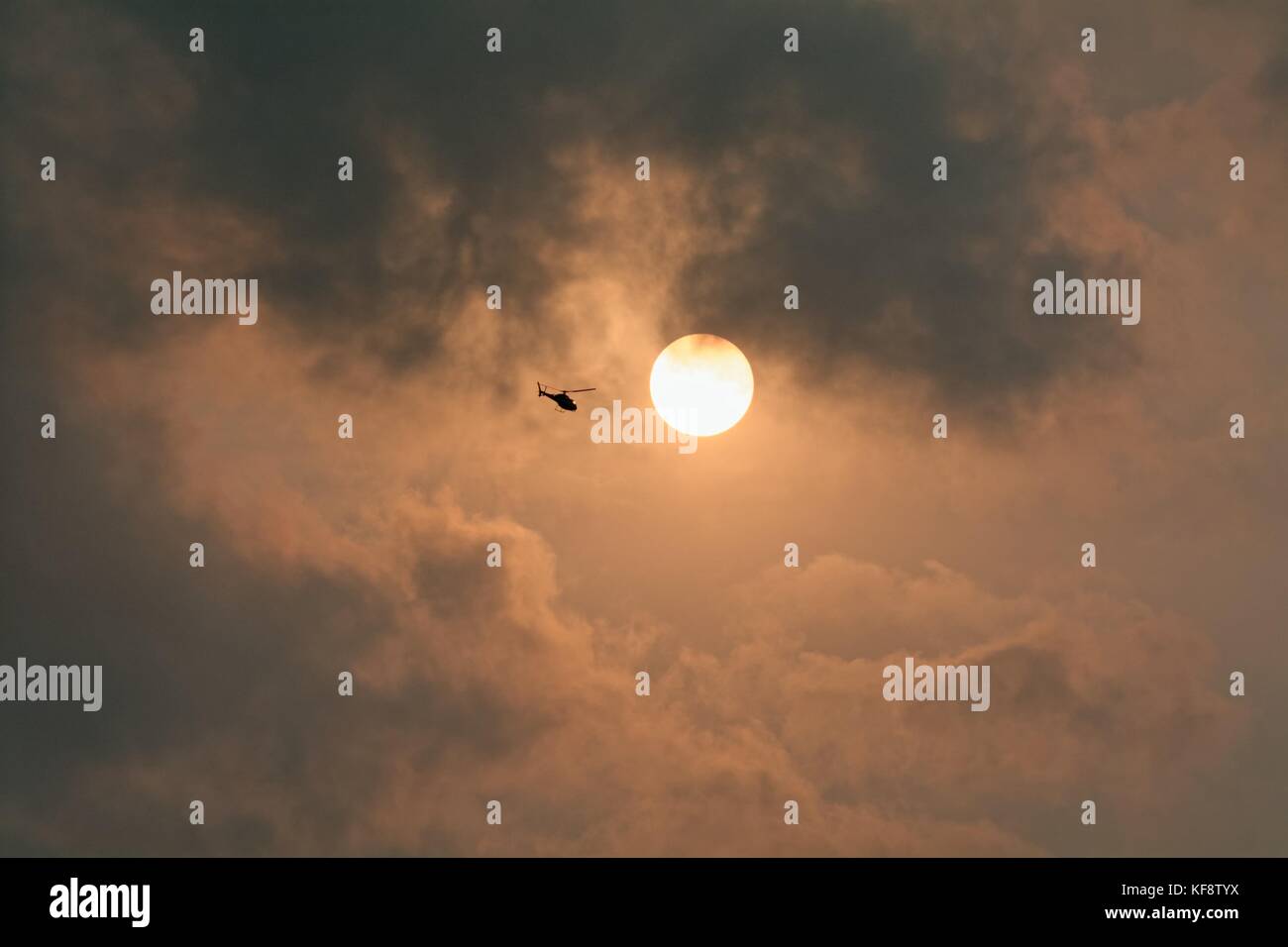 Dramatic red sky and sun caused by dust in the atmosphere from the ...