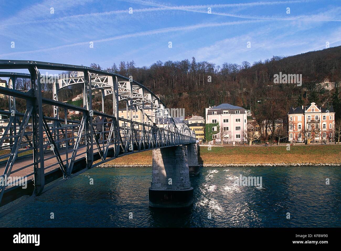 Austria, Salzburg. The Mozart Steg pedestrian bridge over the River ...