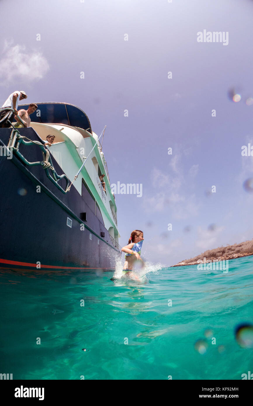 Girls jumping off boat in hi-res stock photography and images - Alamy