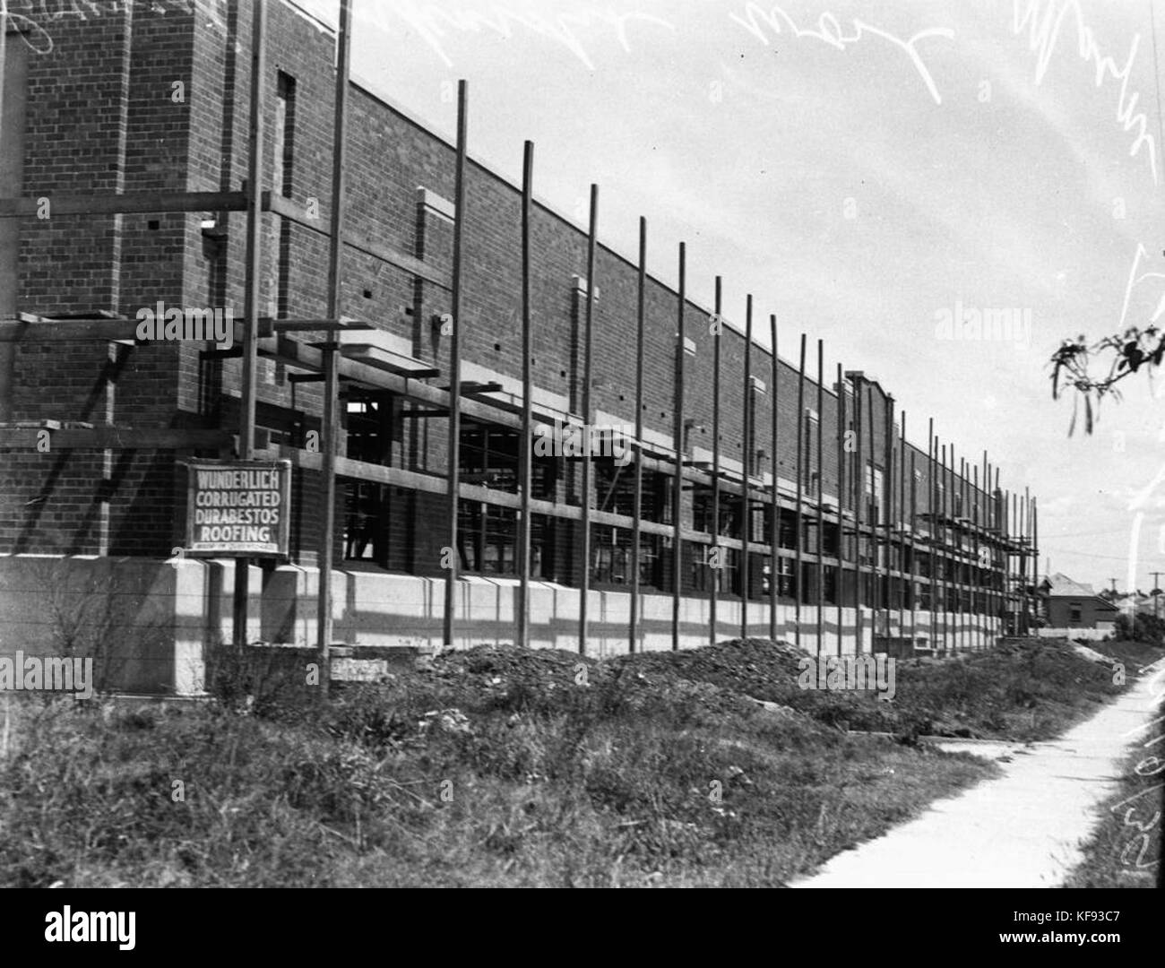 A photograph documenting the construction of a building in Mayne ...