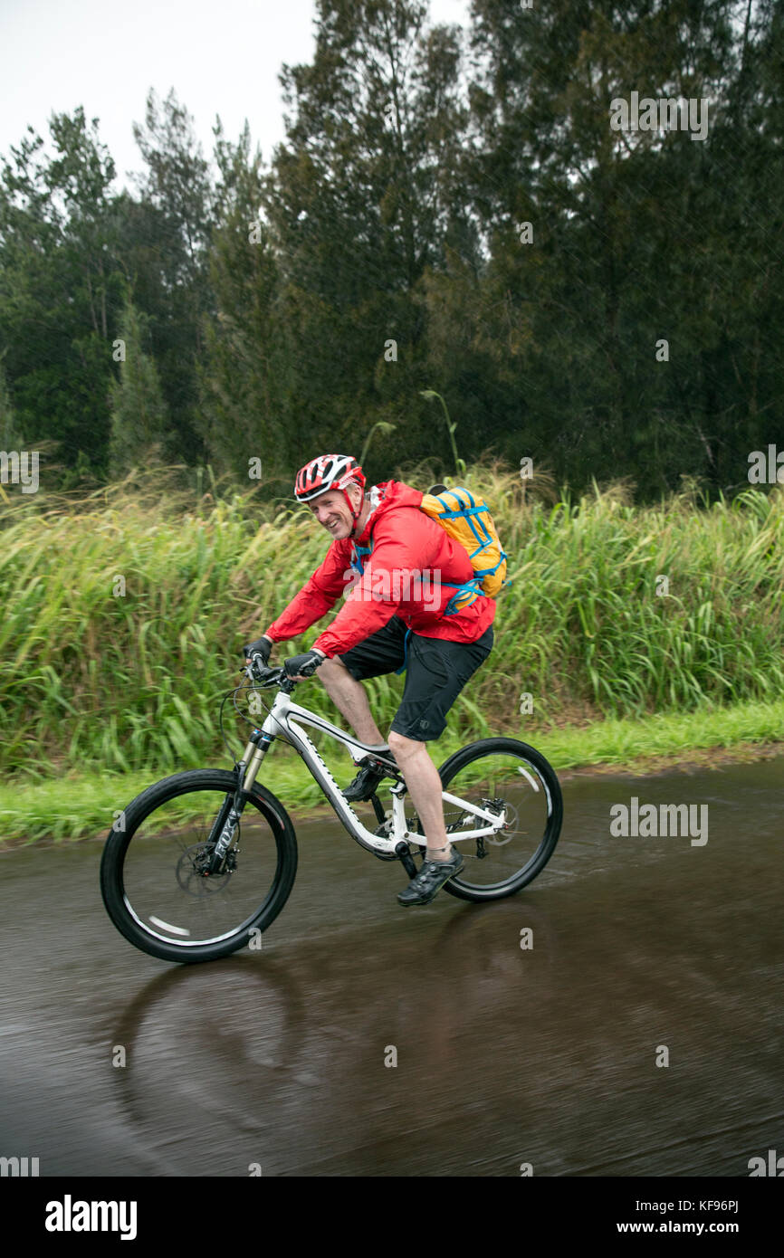USA, Hawaii, The Big Island, journalist Daniel Duane mountain bikes ...