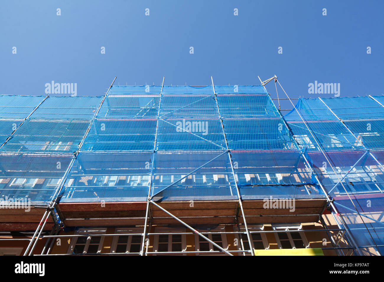 Construction site, old building, protective net Stock Photo - Alamy