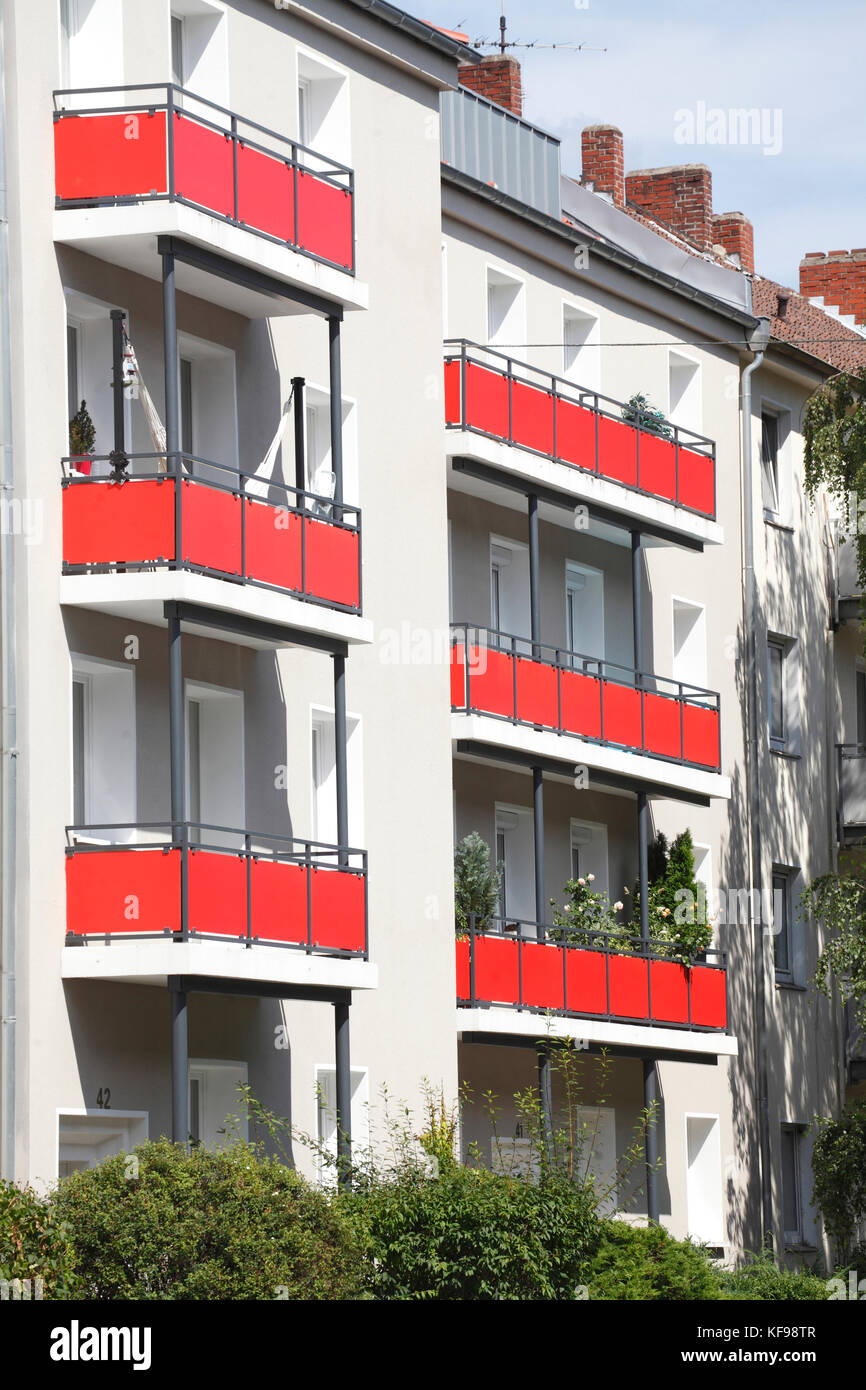 windows and red balconies of modern Residential buildings Stock Photo ...