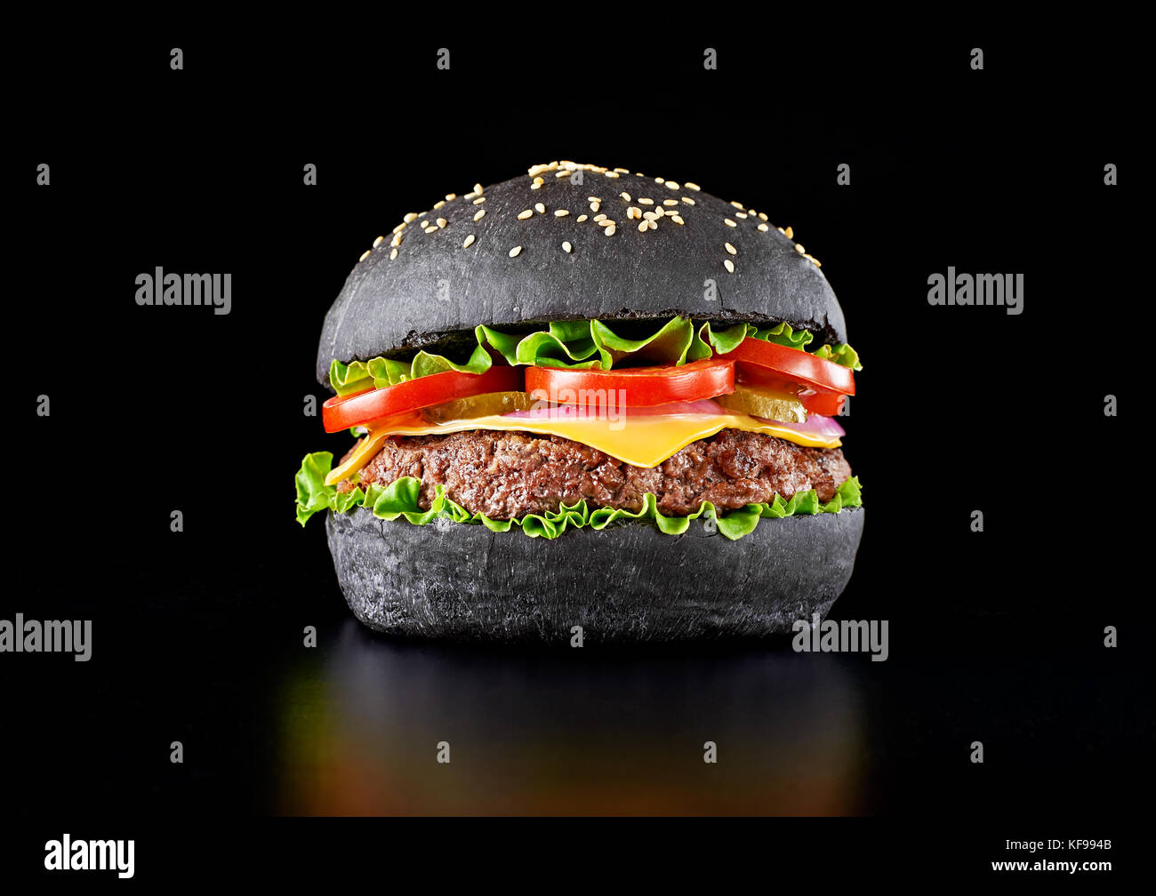 Black burger isolated on black background Stock Photo - Alamy