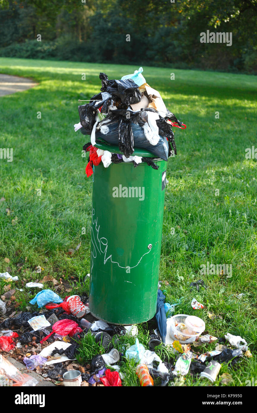 overflowing rubbish bin on a meadow Stock Photo - Alamy