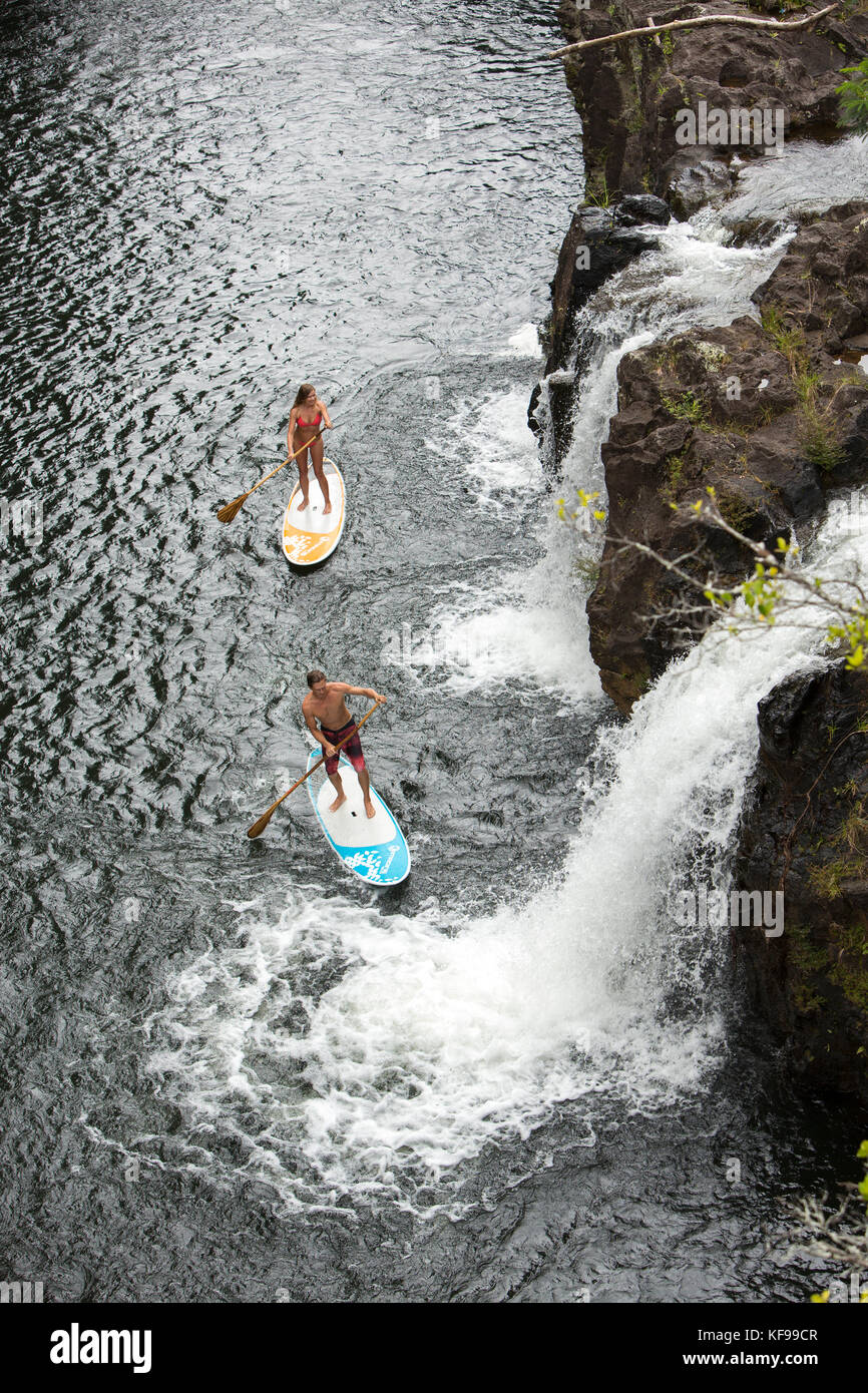 USA, Hawaii, The Big Island, Hilo, paddle boarding on the Wailuku River ...