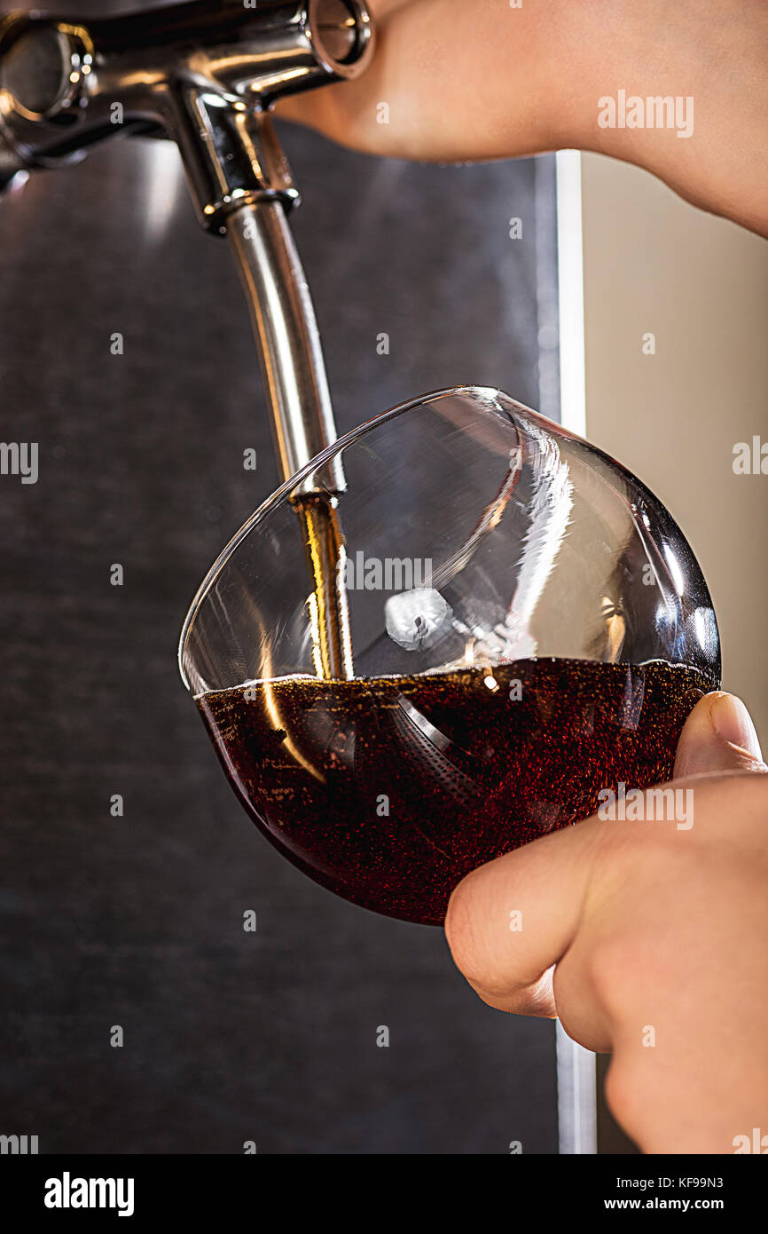 Hand of bartender pouring a large lager beer in tap Stock Photo - Alamy
