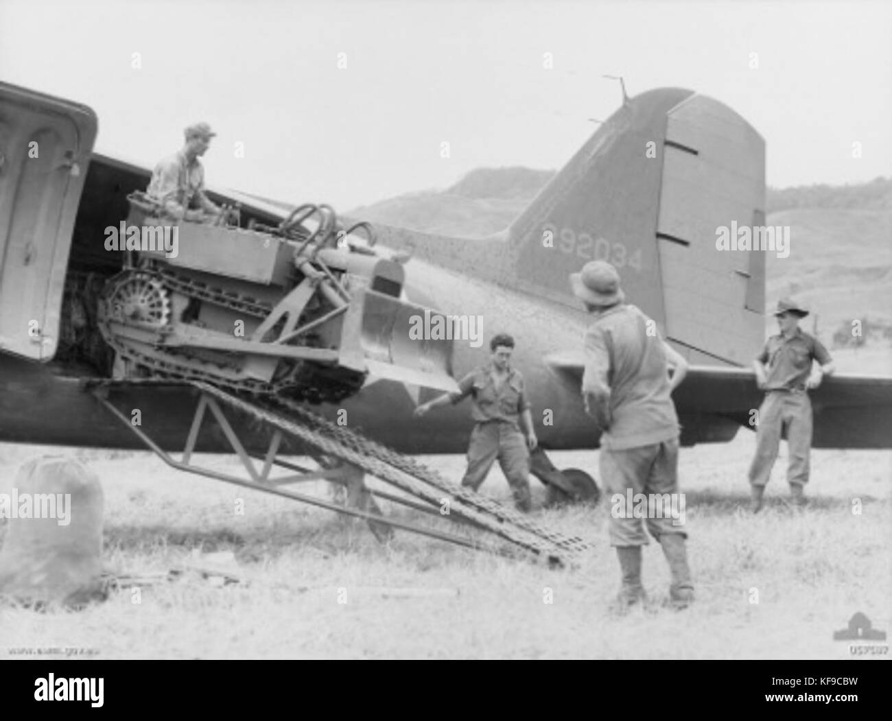 Bulldozer arrives on plane at Kaiapit strip 1943 Stock Photo - Alamy