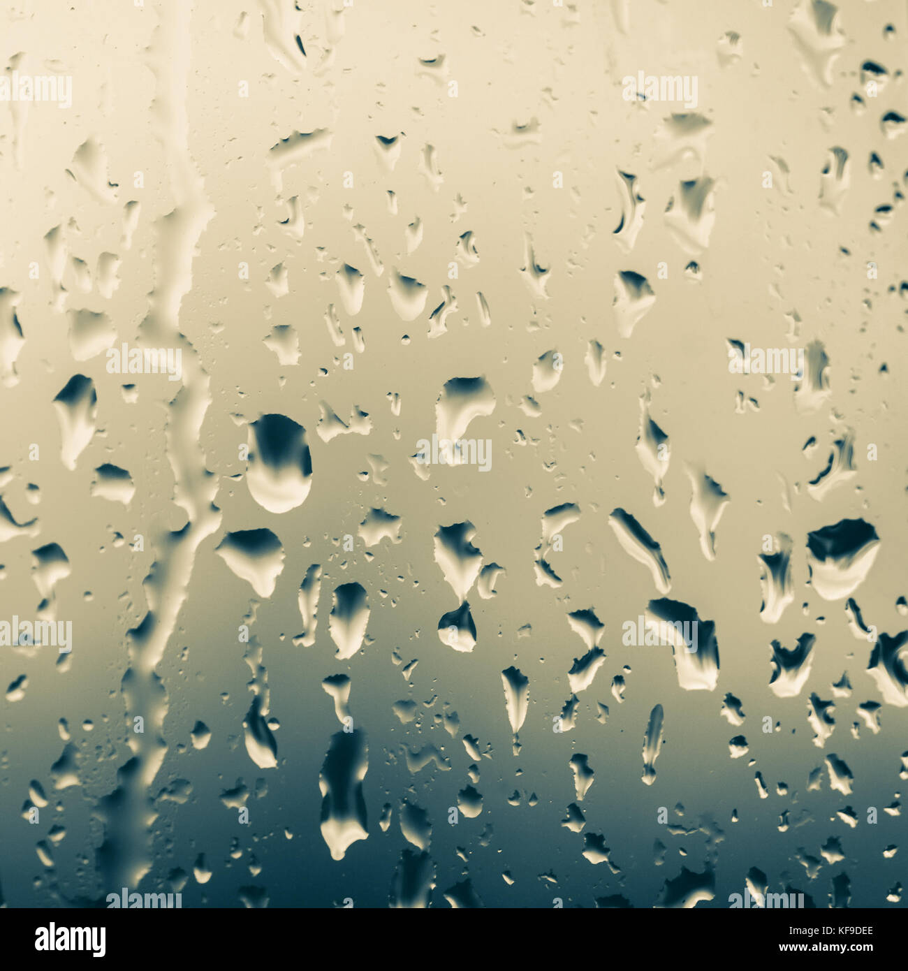 A close-up shot of raindrops flowing down a window Stock Photo - Alamy