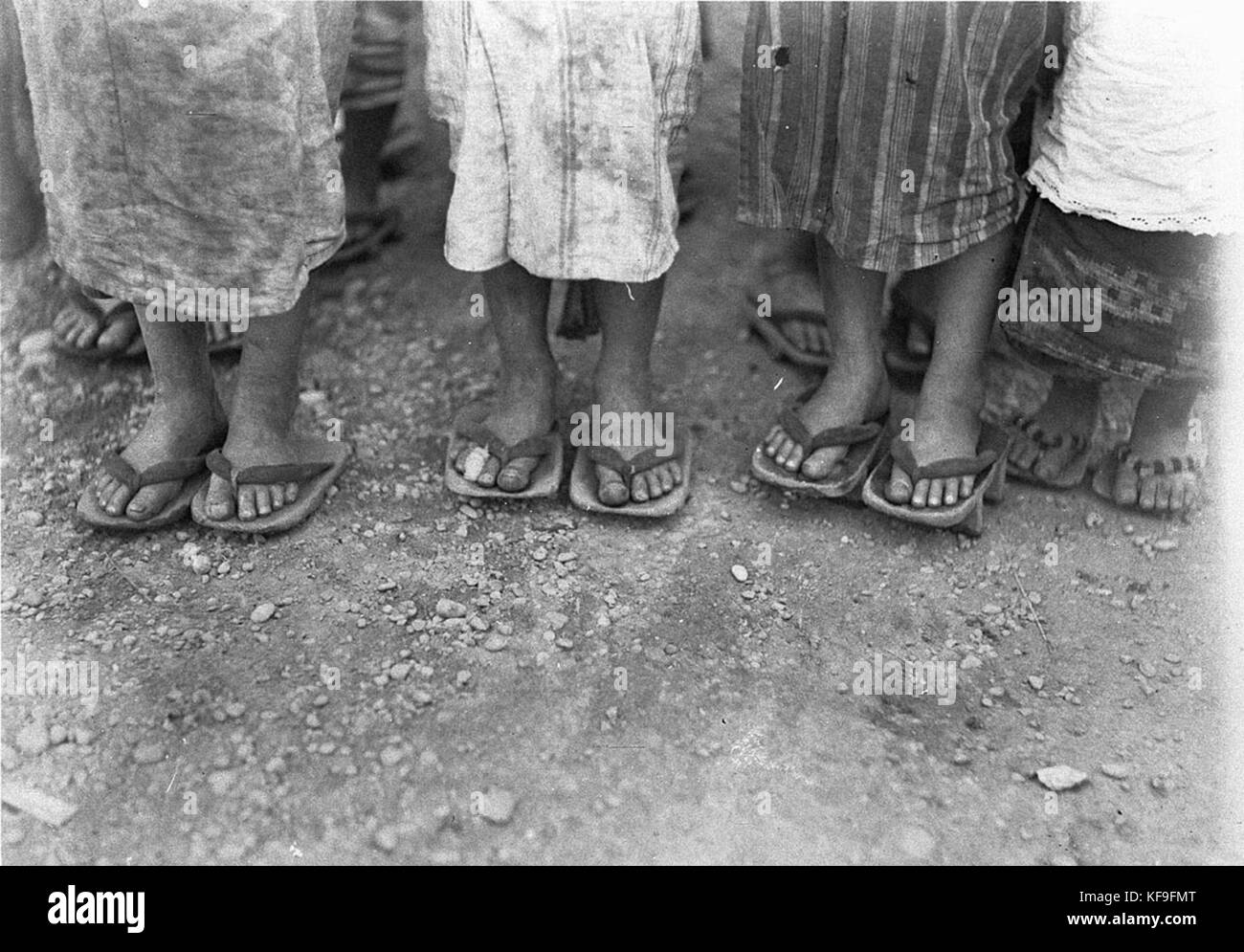 51050 Feet of Chinese labourers showing wooden thongs Stock Photo - Alamy