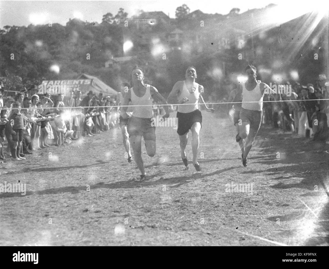 Athletes finish line Black and White Stock Photos & Images - Alamy