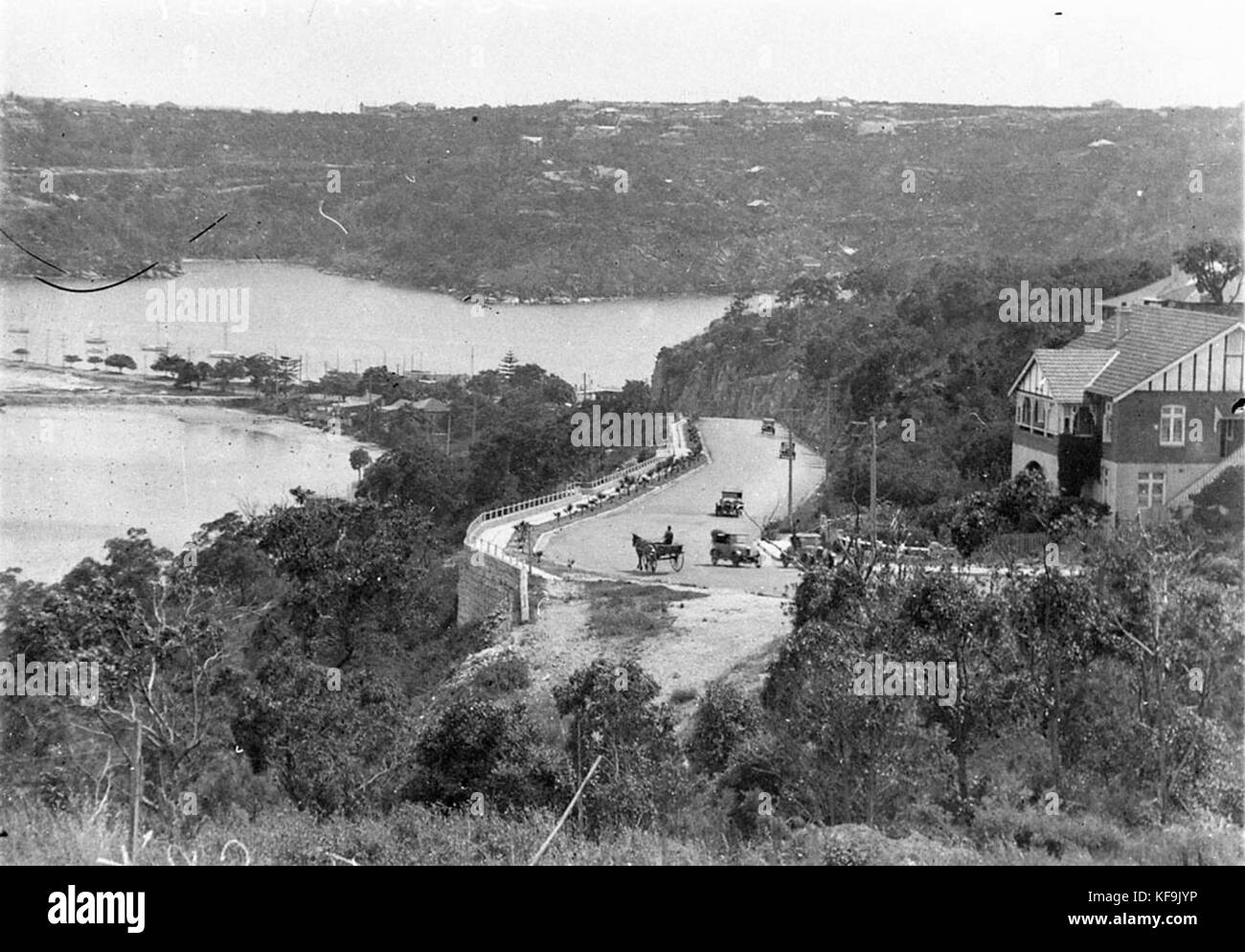8877 Spit Road leading down from Mosman to the Spit with five cars and ...