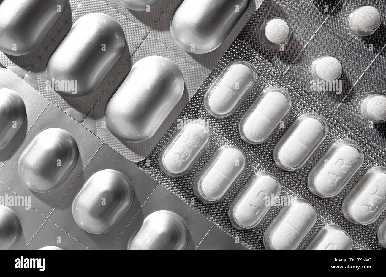 medicine tablets in silver foil packaging Stock Photo - Alamy