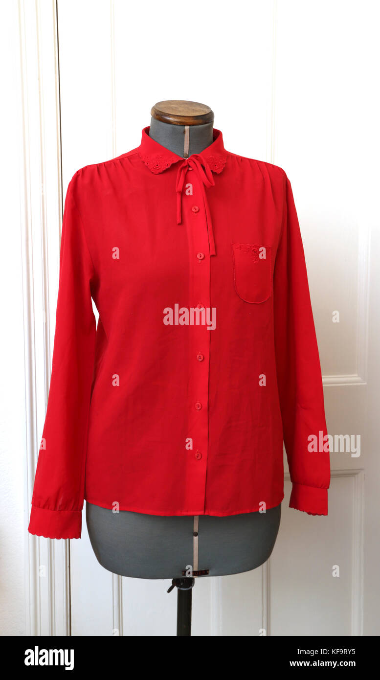 Red Blouse With Tie Around neck on Singer Mannequin Stock Photo - Alamy