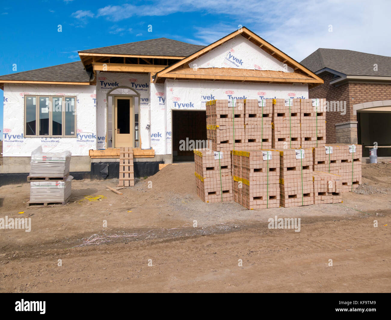 New homes in subdivision being build with 2 story as well as semis ...