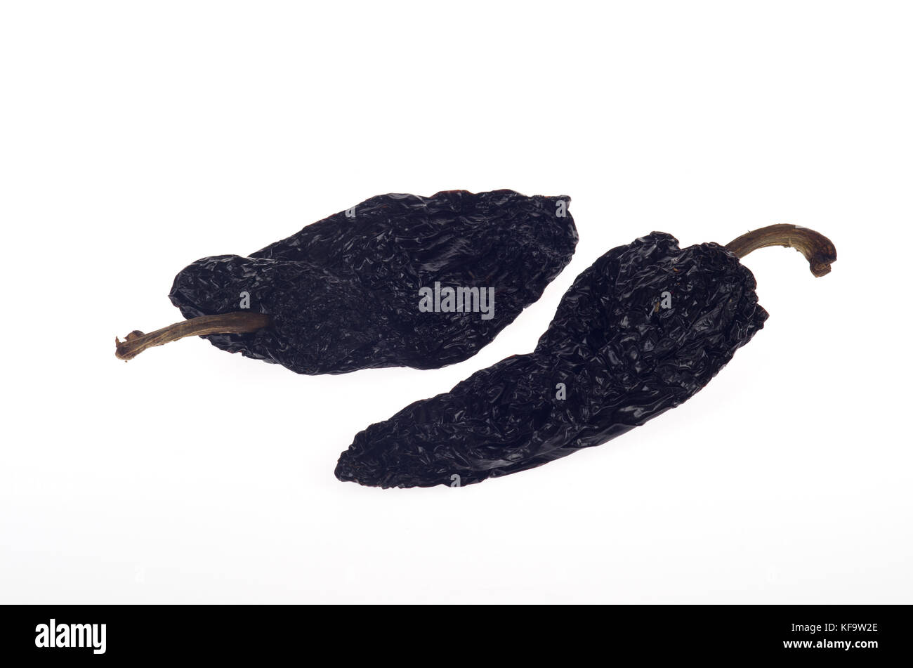 2 dried ancho chili peppers Stock Photo - Alamy