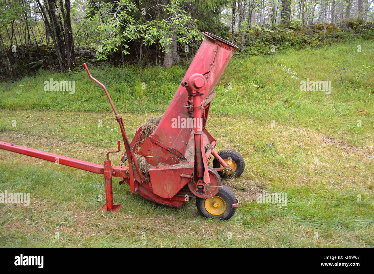 An old tractor drawn grass forage harvester with the top section ...