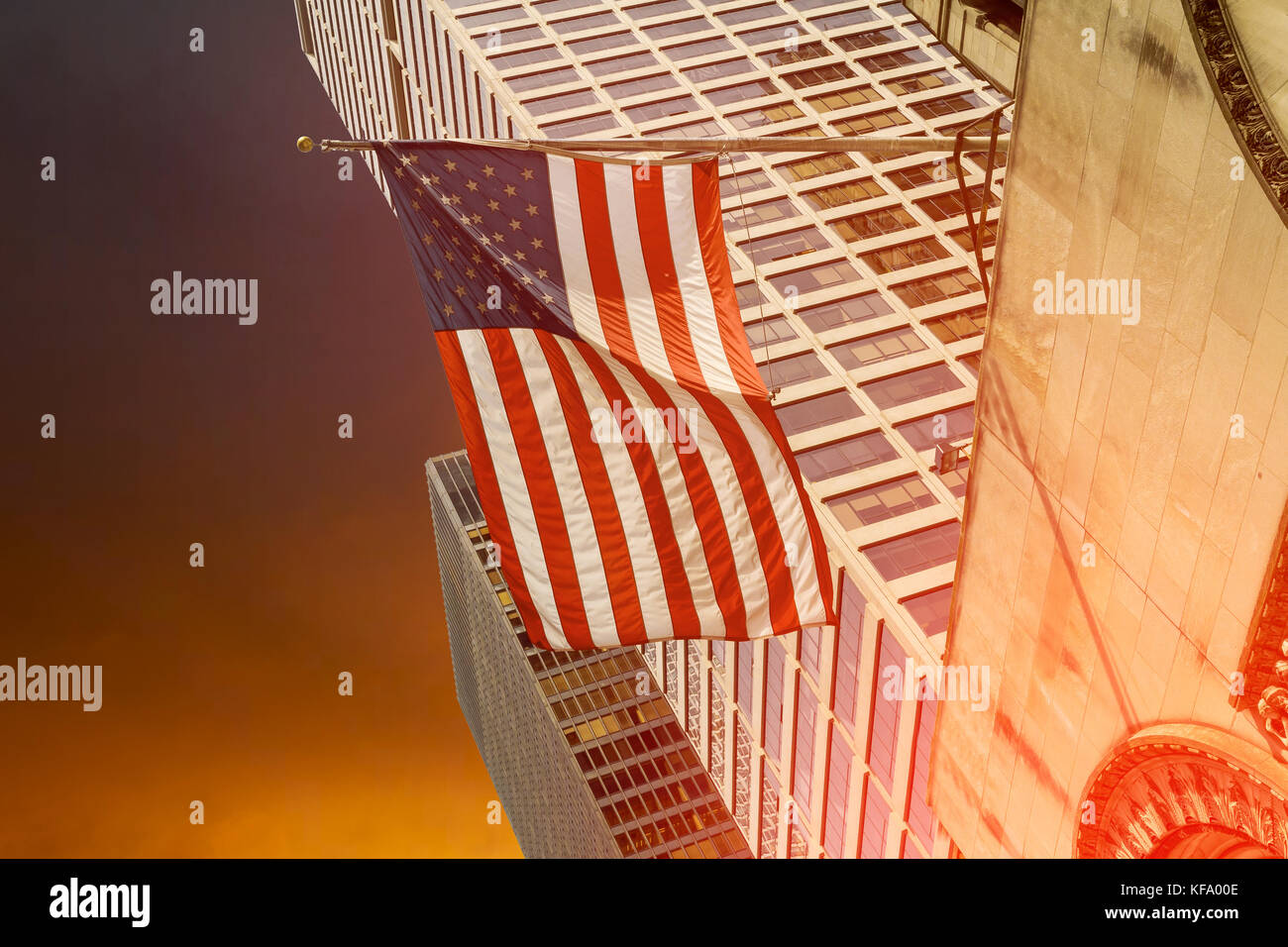 Flag flying in front of a corporate office building American flag in ...