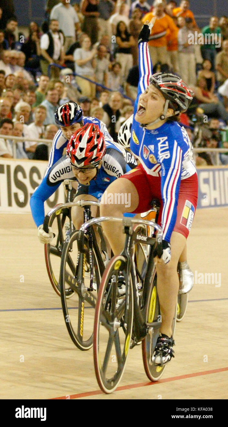Clara Sanchez of France, right, raise her arm in victory while crossing ...