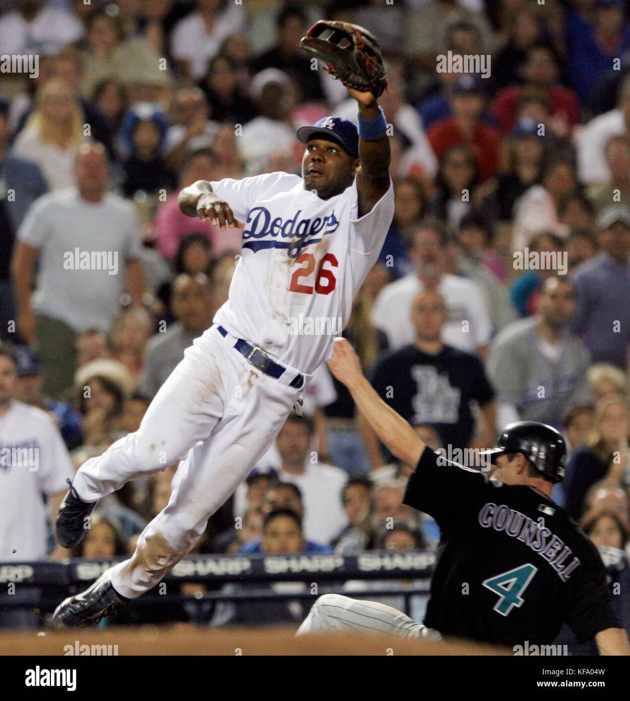 Los Angeles Dodgers third baseman Antonio Perez, left, leaps to try to ...