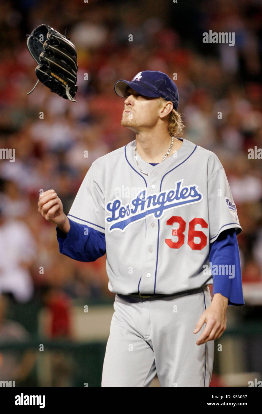 Los Angeles Dodgers pitcher Jeff Weaver tosses his glove in the air ...