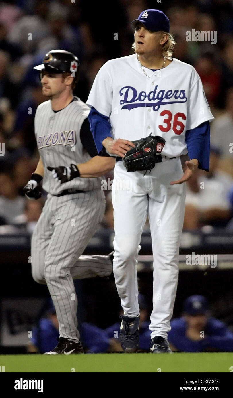 Los Angeles Dodgers pitcher Jeff Weaver, right, walks to the mound ...