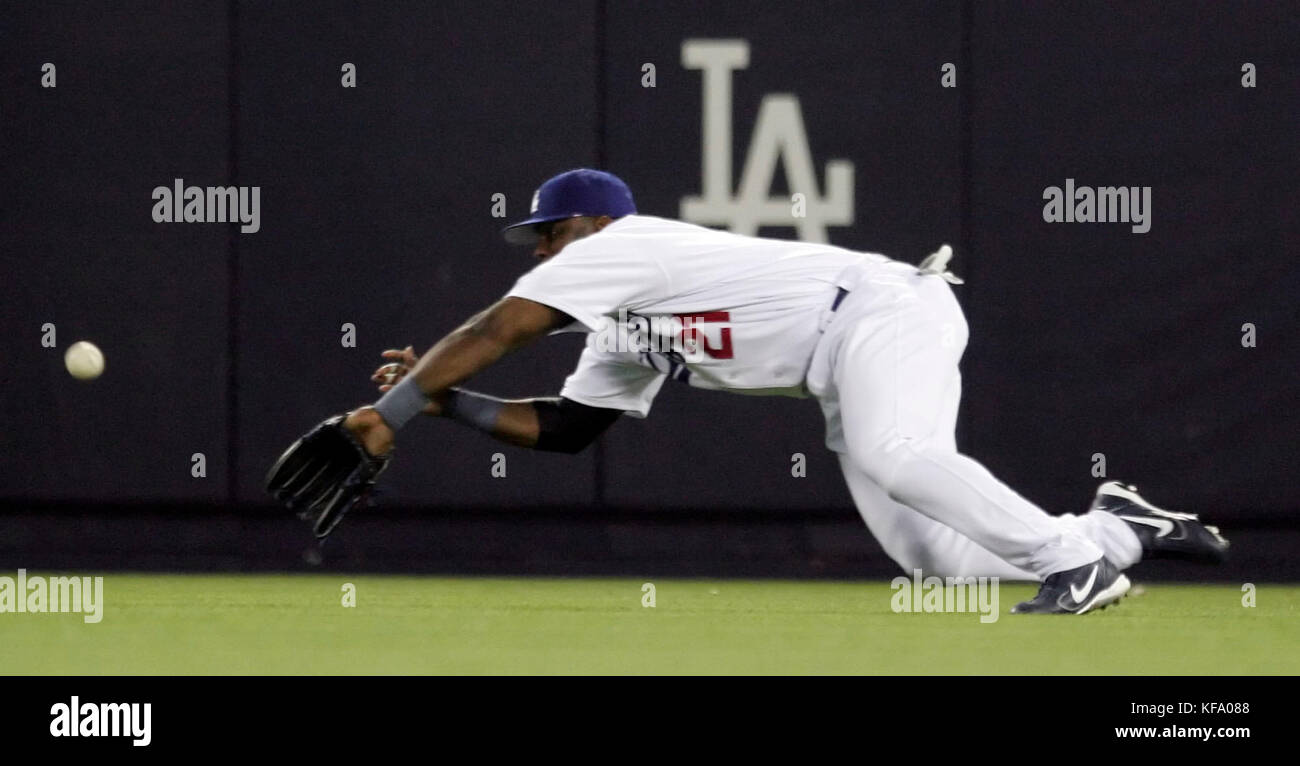 Los Angeles Dodgers' centerfielder Milton Bradley makes a diving catch ...