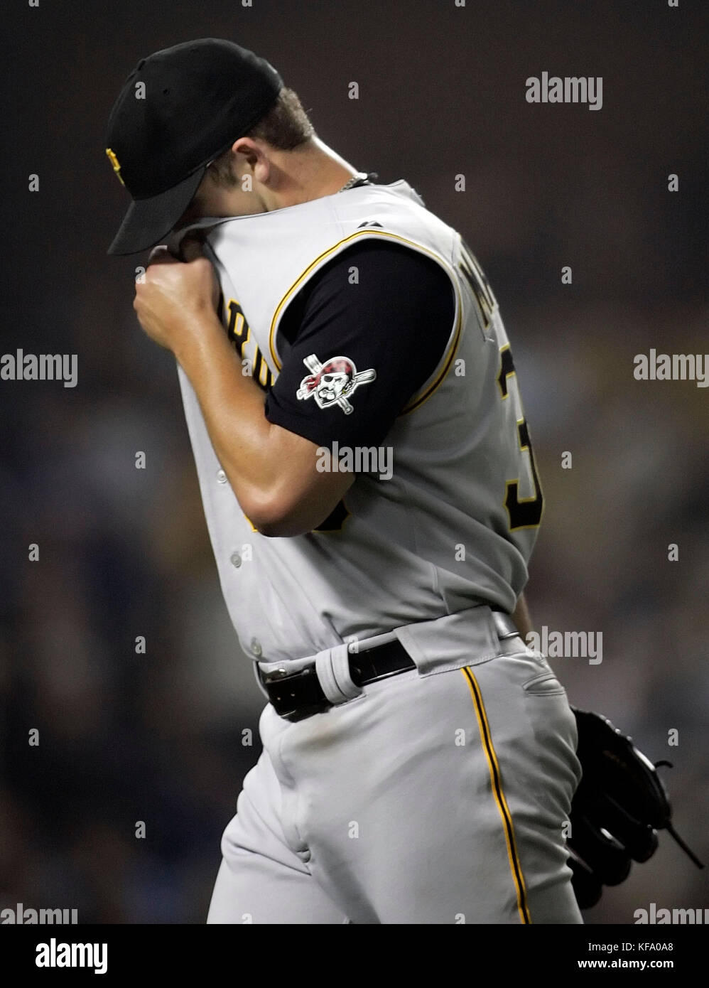 Pittsburgh Pirates pitcher Paul Maholm wipes his face with his shirt on ...