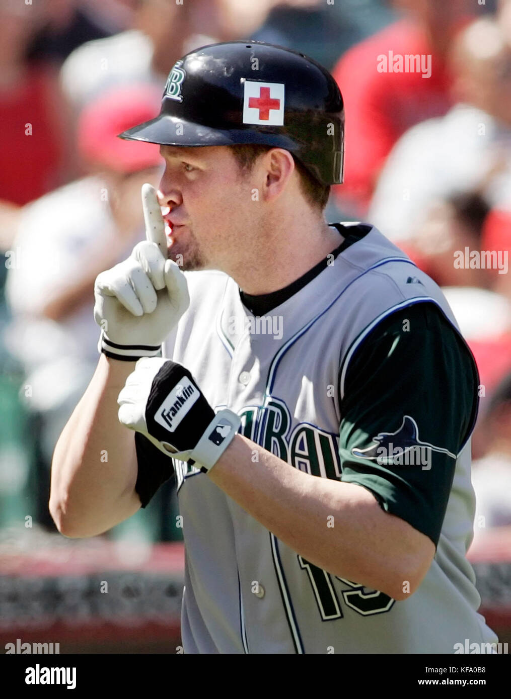 Tampa Bay Devil Rays' Aubrey Huff puts his finger to his lips to quiet ...