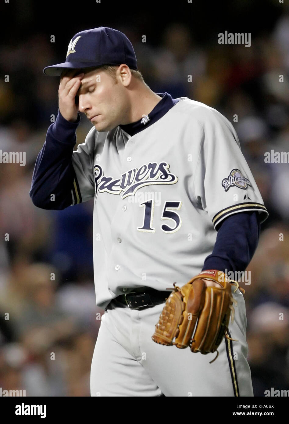 Milwaukee Brewers pitcher Ben Sheets rubs his brow on the way to the ...