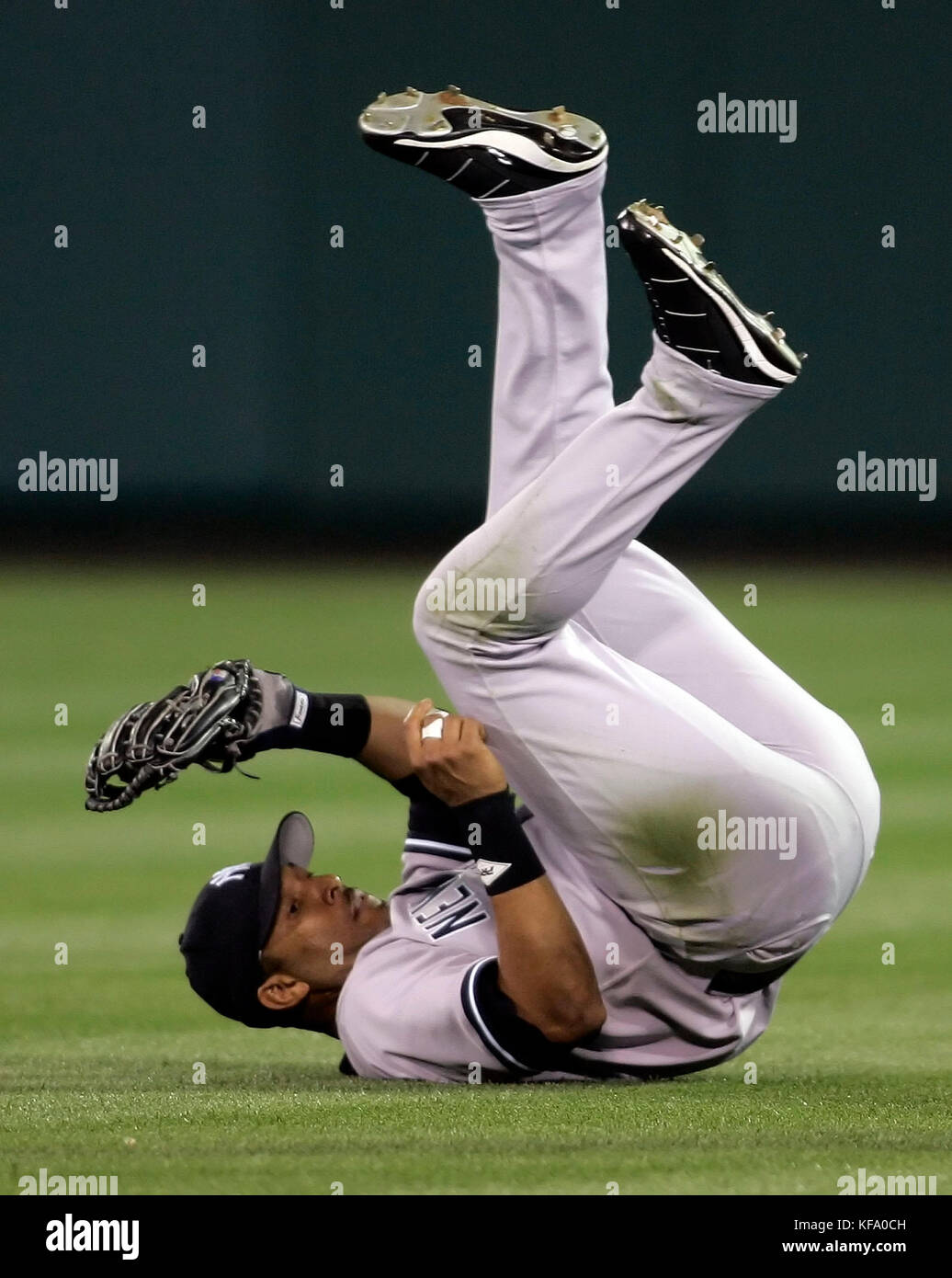 New York Yankees right fielder Gary Sheffield takes a tumble on a catch ...
