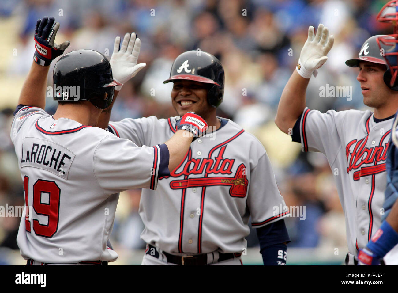Atlanta Braves' Adam LaRoche, left, is greeted at home plate by ...